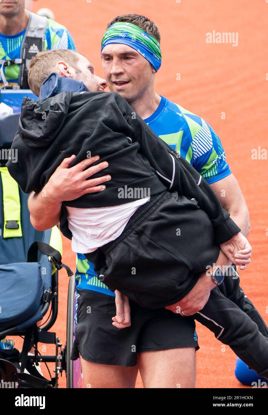 Rob Burrow and Kevin Sinfield cross the finish line of the 2023 Rob ...