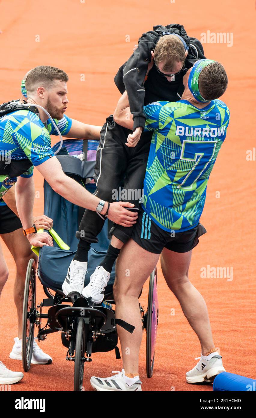 Rob Burrow and Kevin Sinfield cross the finish line of the 2023 Rob ...