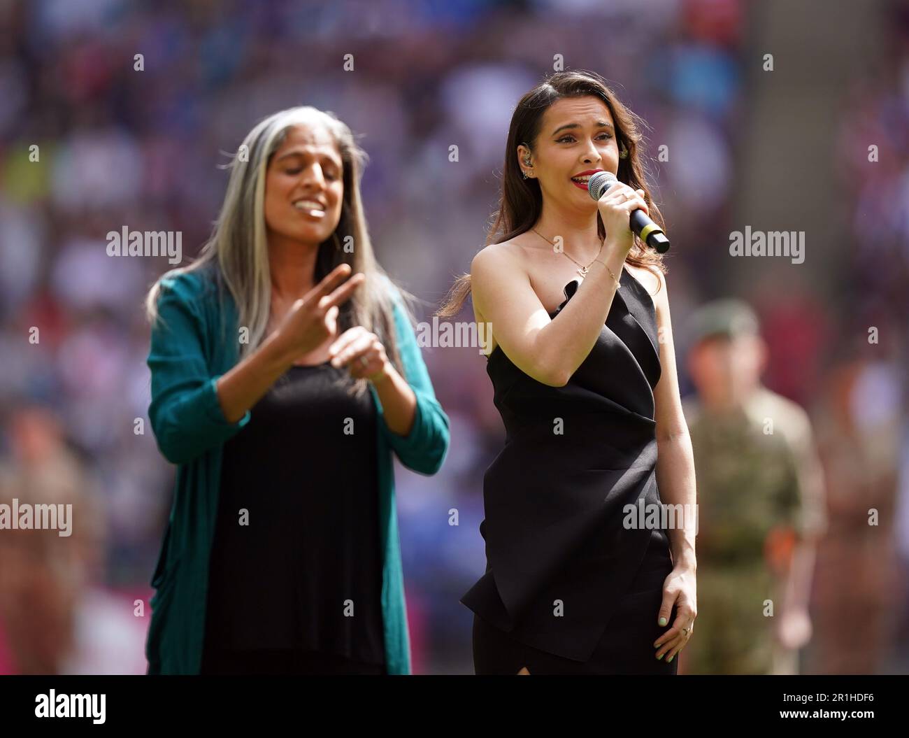 Jasmine Faulkne (right) r singing the national anthem ahead of the ...