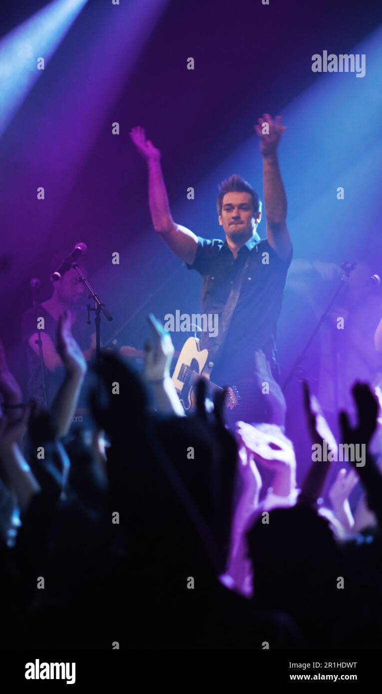 People hands, music and singer at concert in night performance, rock ...