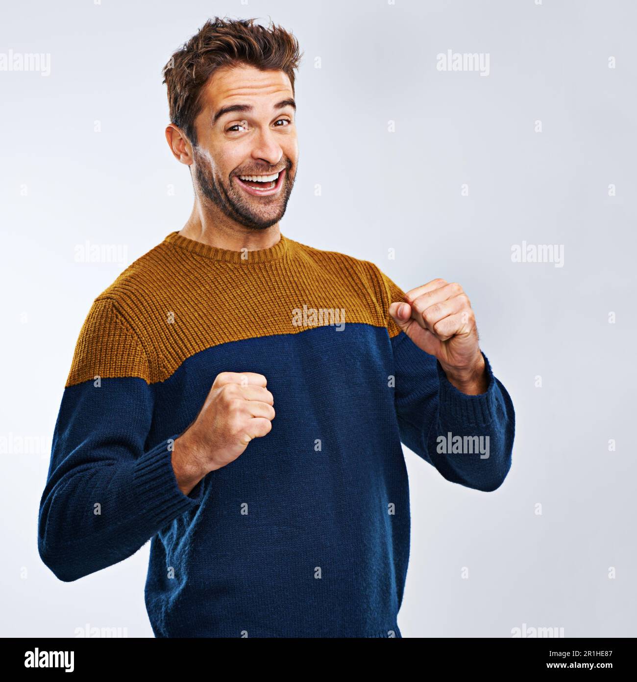 Portrait, winner and man with energy, fist and excitement with guy ...