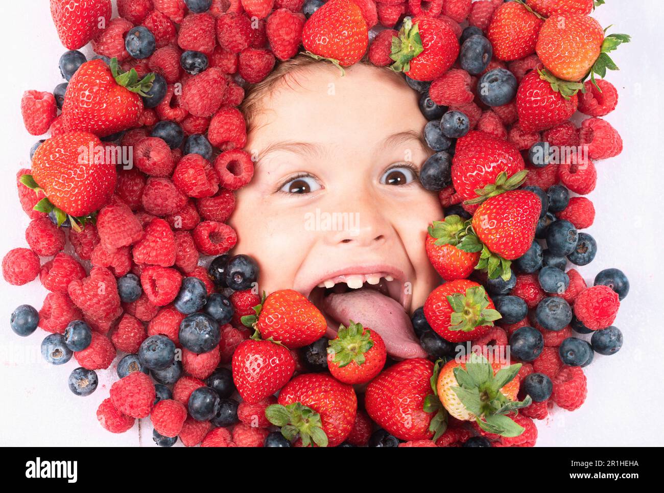 Funny fruits. The kids face with fruit and berries. Summer strawberry ...