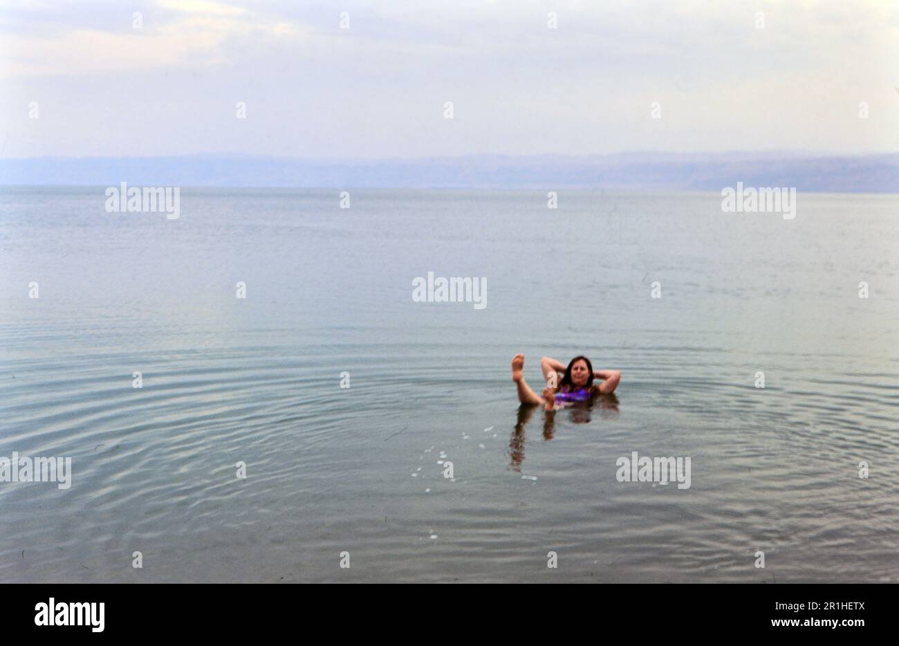 Jordan: Tourists visit a Dead Sea bathing area; very bouyant due to ...