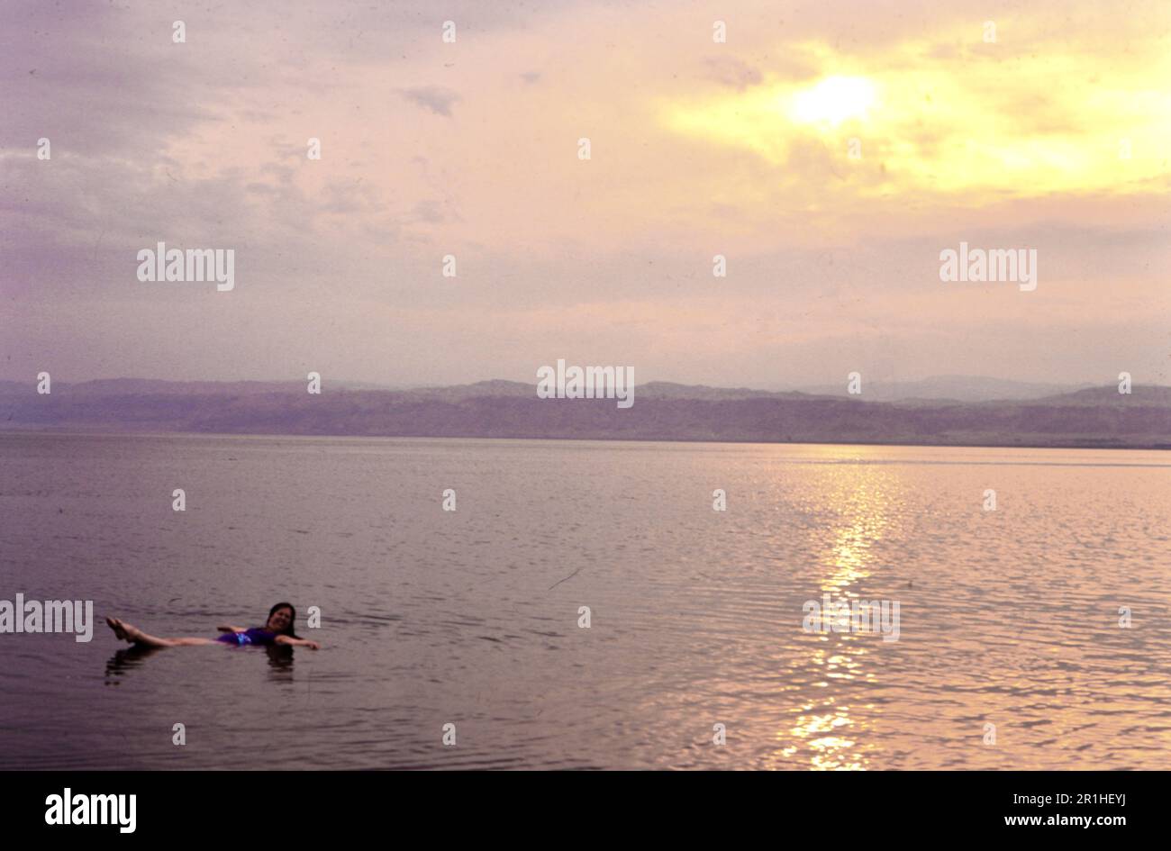 Jordan: Tourists visit a Dead Sea bathing area; very bouyant due to ...