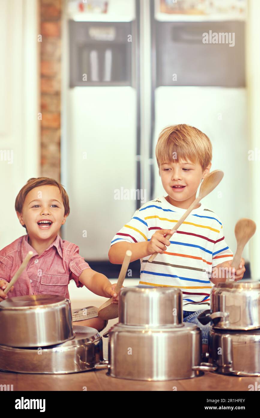 Drummer, pots and playing with children in kitchen for imagination ...
