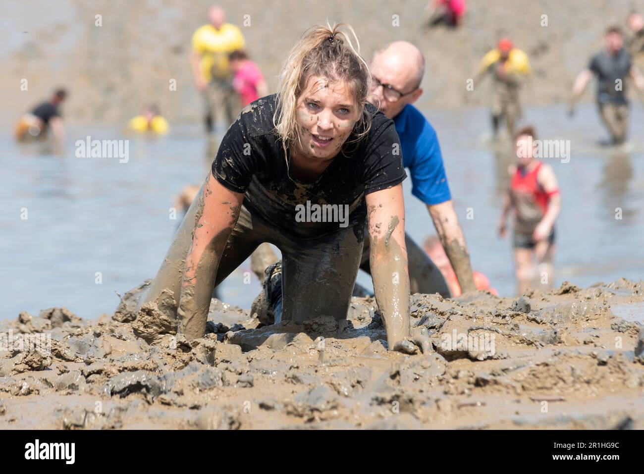 Female crawling in mud hi-res stock photography and images - Alamy