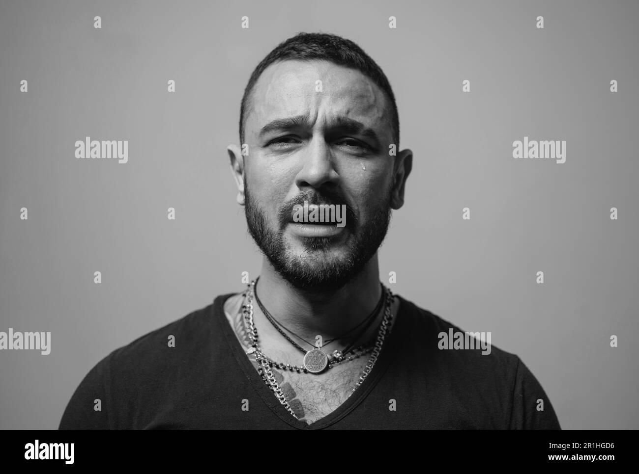 Sad face of young guy. Man cry with tears. Closeup portrait of a crying ...