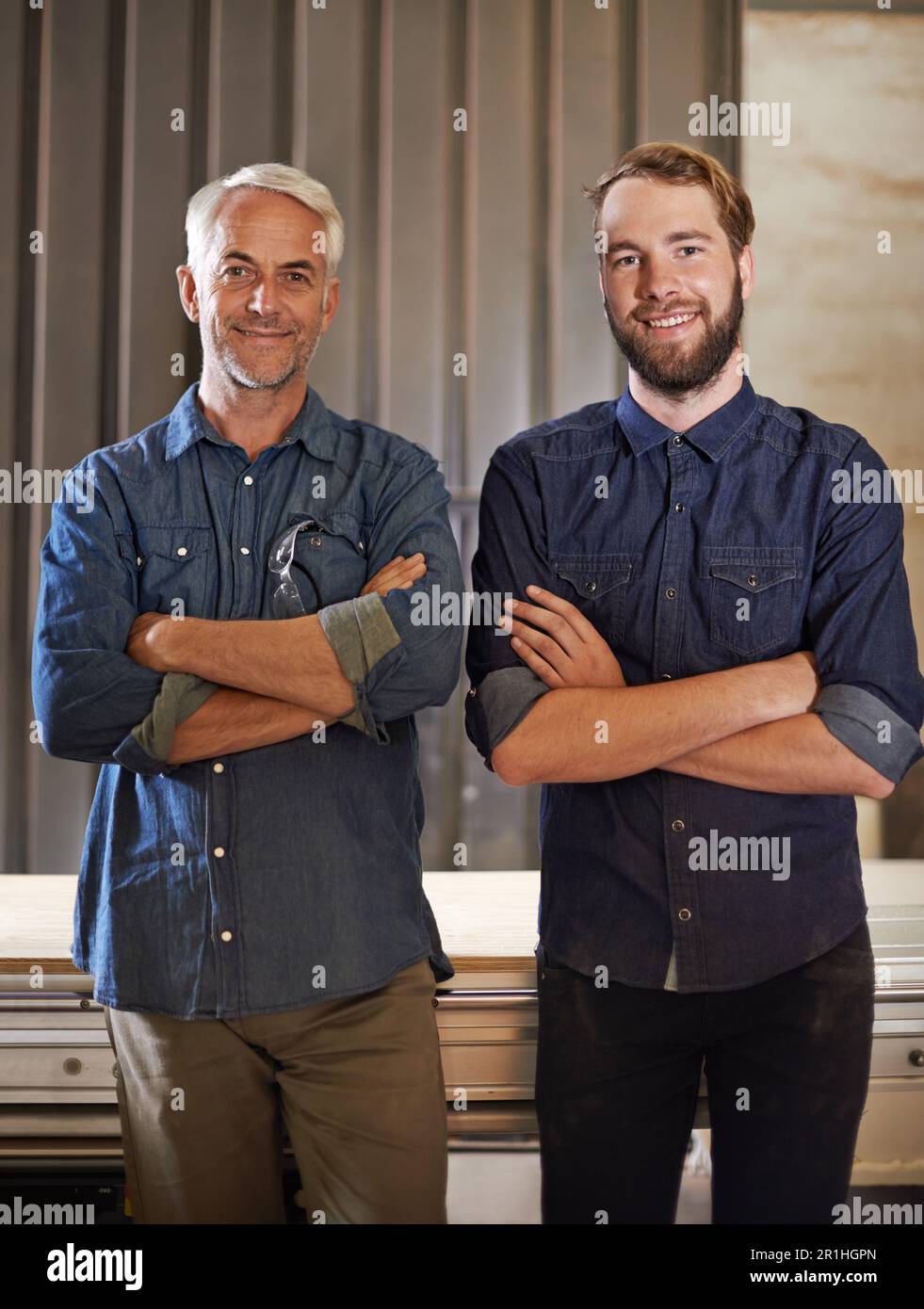 Family, happy portrait and arms crossed of father and son woodwork team ...