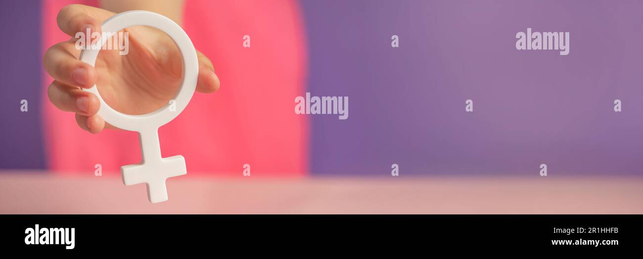 Gender symbol of a woman. Banner with woman symbol in hands on purple ...