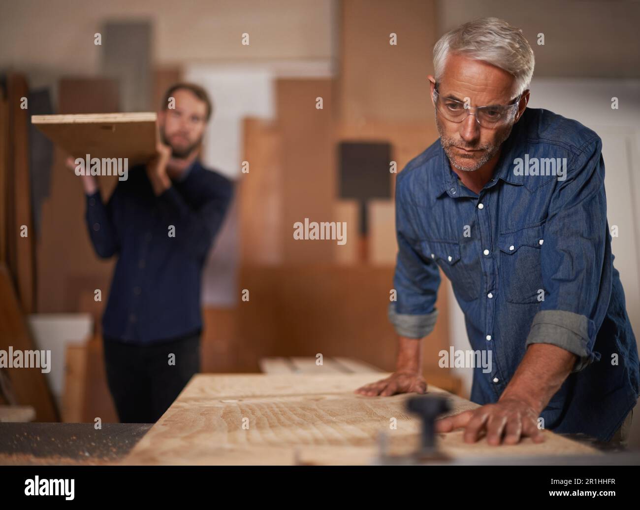 Carpenter team, men in collaboration and work in workshop on design ...