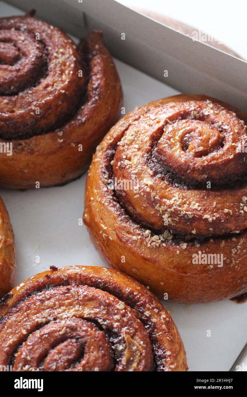 Glazed Cinnamon roll Stock Photo - Alamy