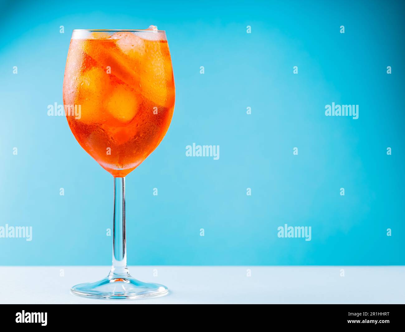 Aperol Spritz cocktail in glass on a blue background. Classic italian ...