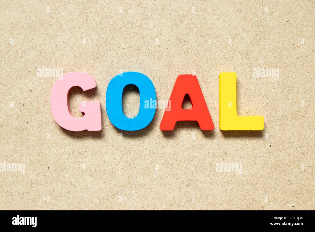 Color alphabet letter in word goal on wood background Stock Photo - Alamy