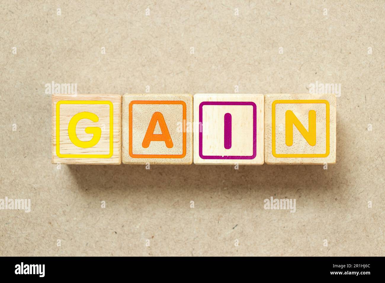 Wooden alphabet letter block in word gain on wood background Stock ...