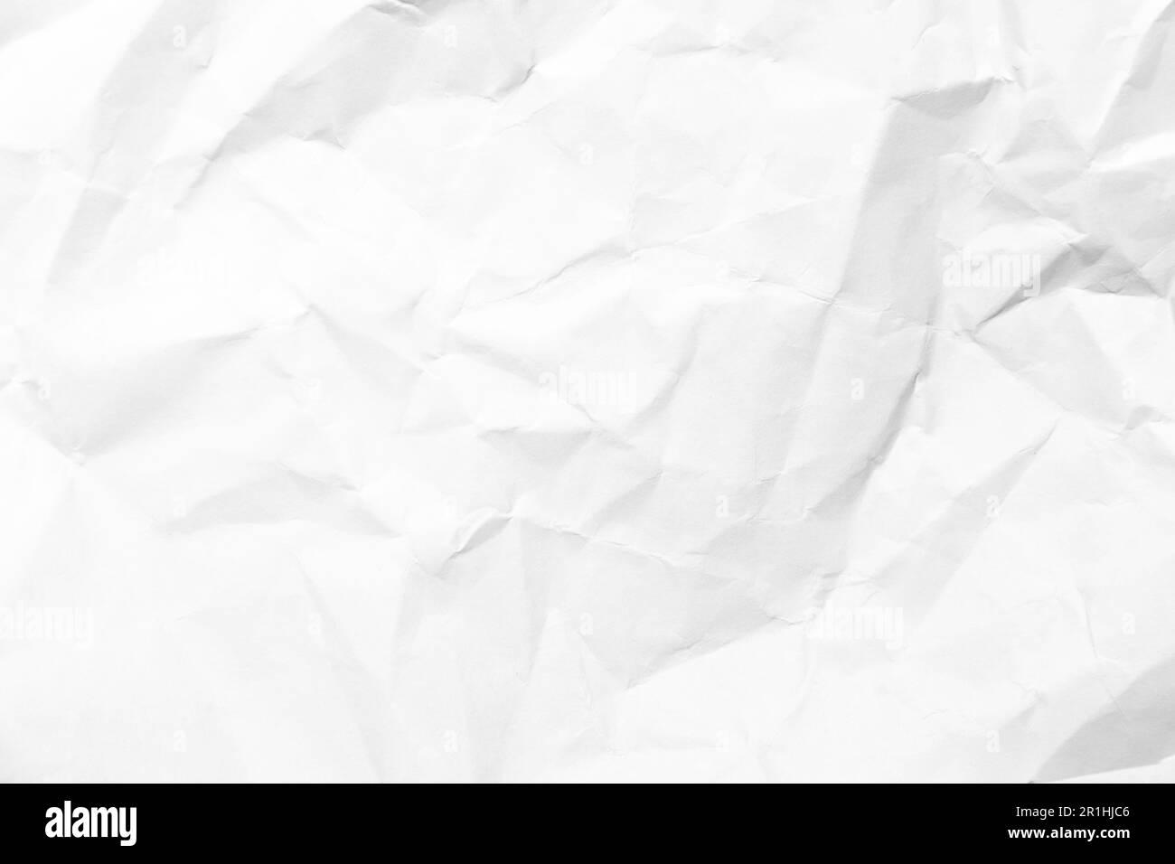 Grunge wrinkled white color paper textured background with copy space ...