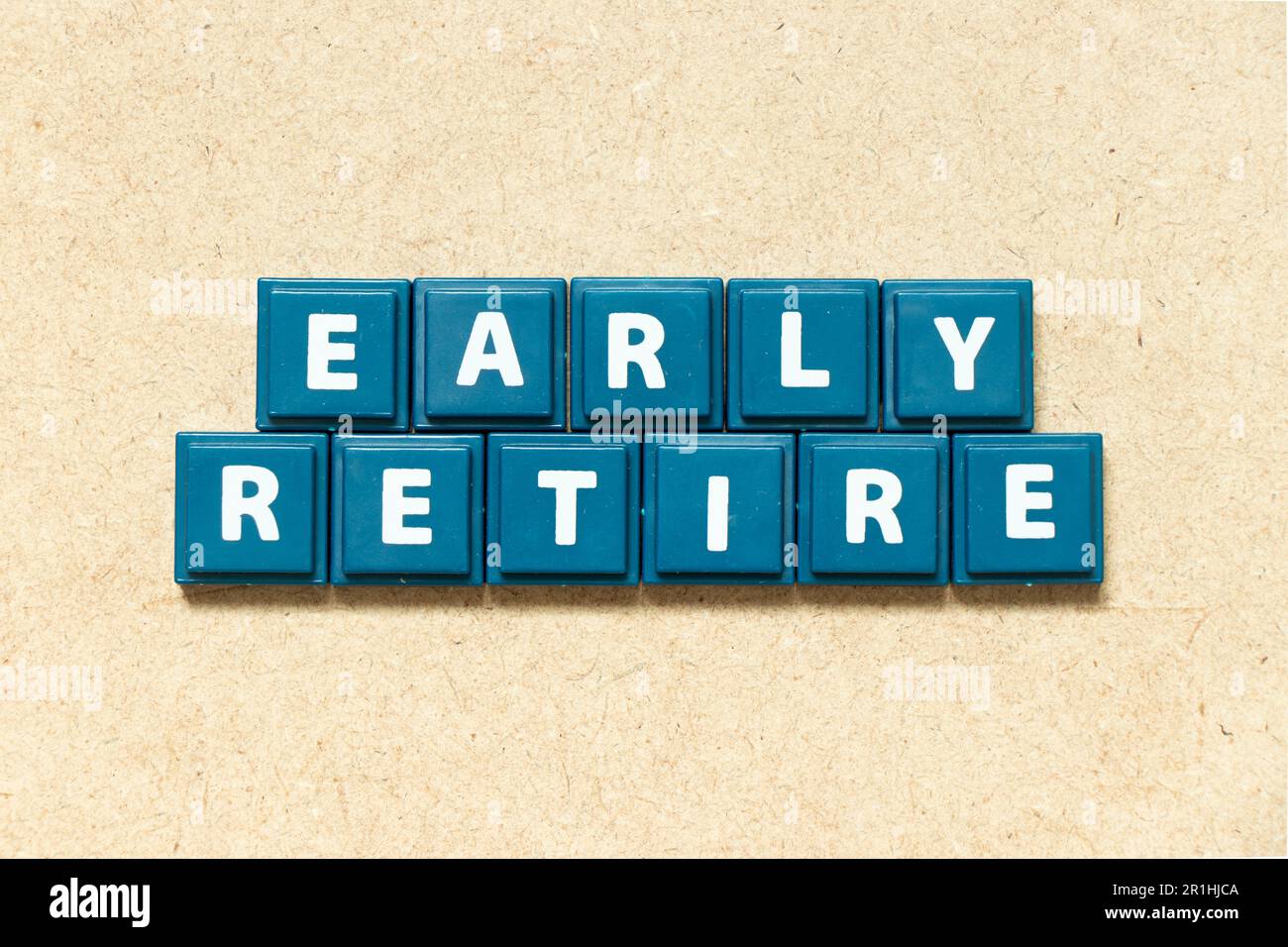 Tile alphabet letter in word early retire on wood background Stock ...