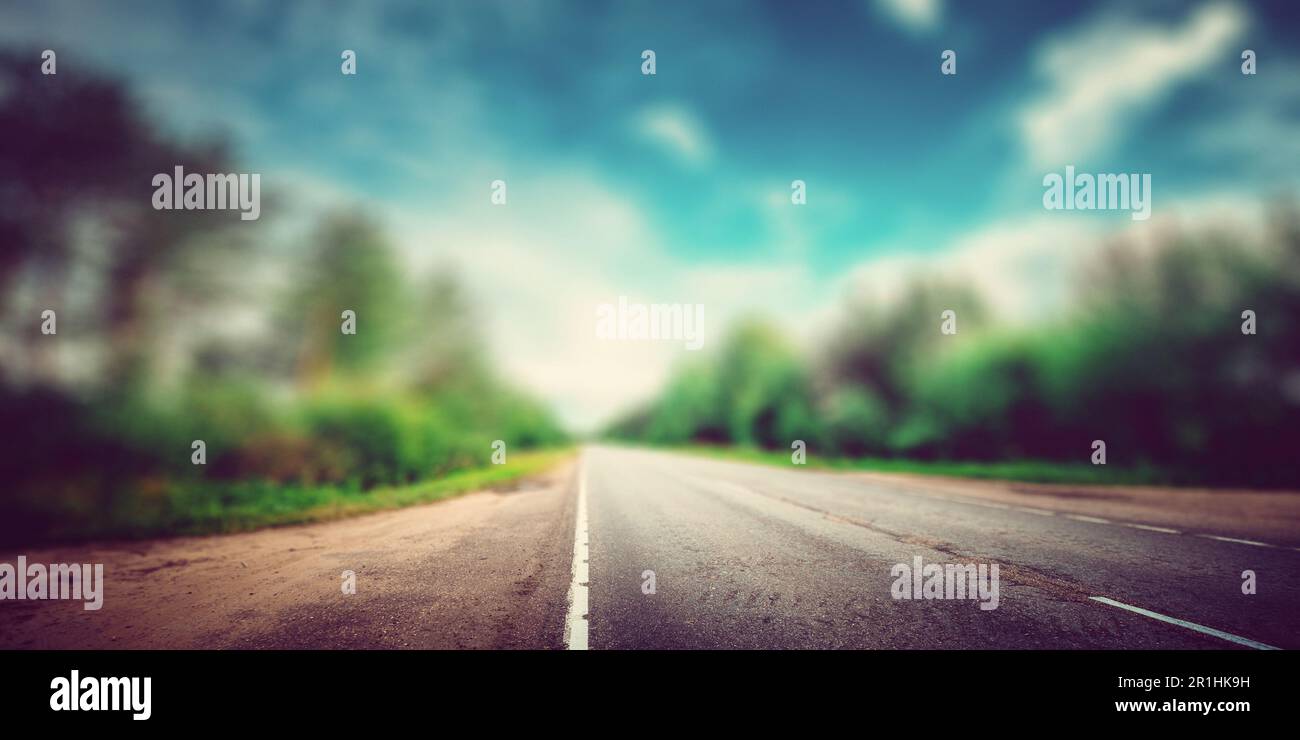 Road in forest blur tilt effect panoramic Stock Photo - Alamy