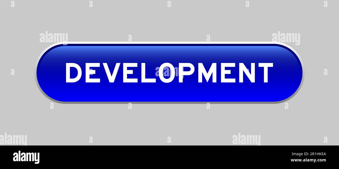 Blue color capsule shape button with word development on gray ...