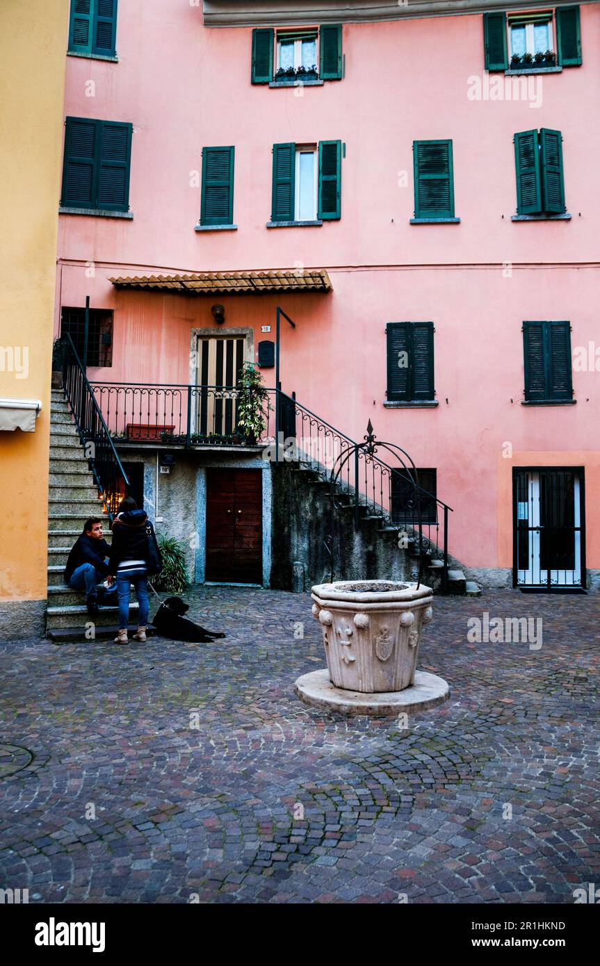 A courtyard and well in the Italian city of Lecco on the southeastern ...