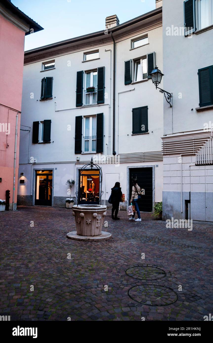 A courtyard and well in the Italian city of Lecco Lake Como Stock Photo ...
