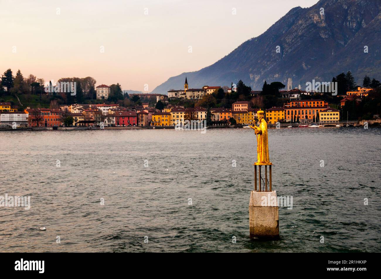 Golden statue of San Nicolò in Lake Como from Lecco, Italy Stock Photo ...