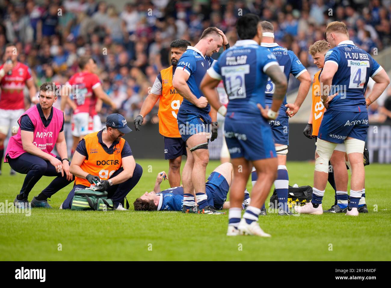 Sale Sharks players watch on as Ben Curry #7 of Sale Sharks as he ...