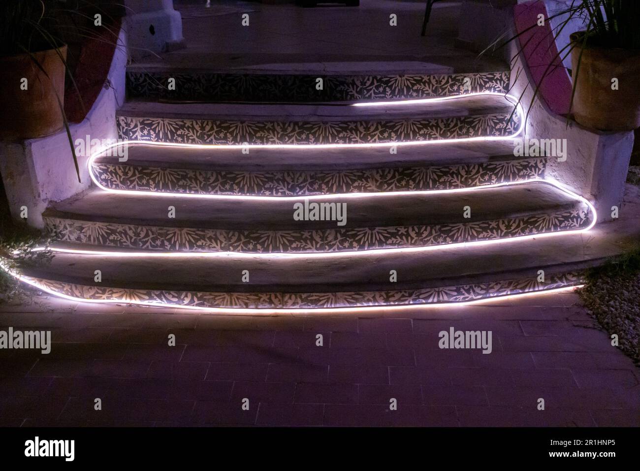 white lights on the steps of a restaurant front entrance in Merida ...