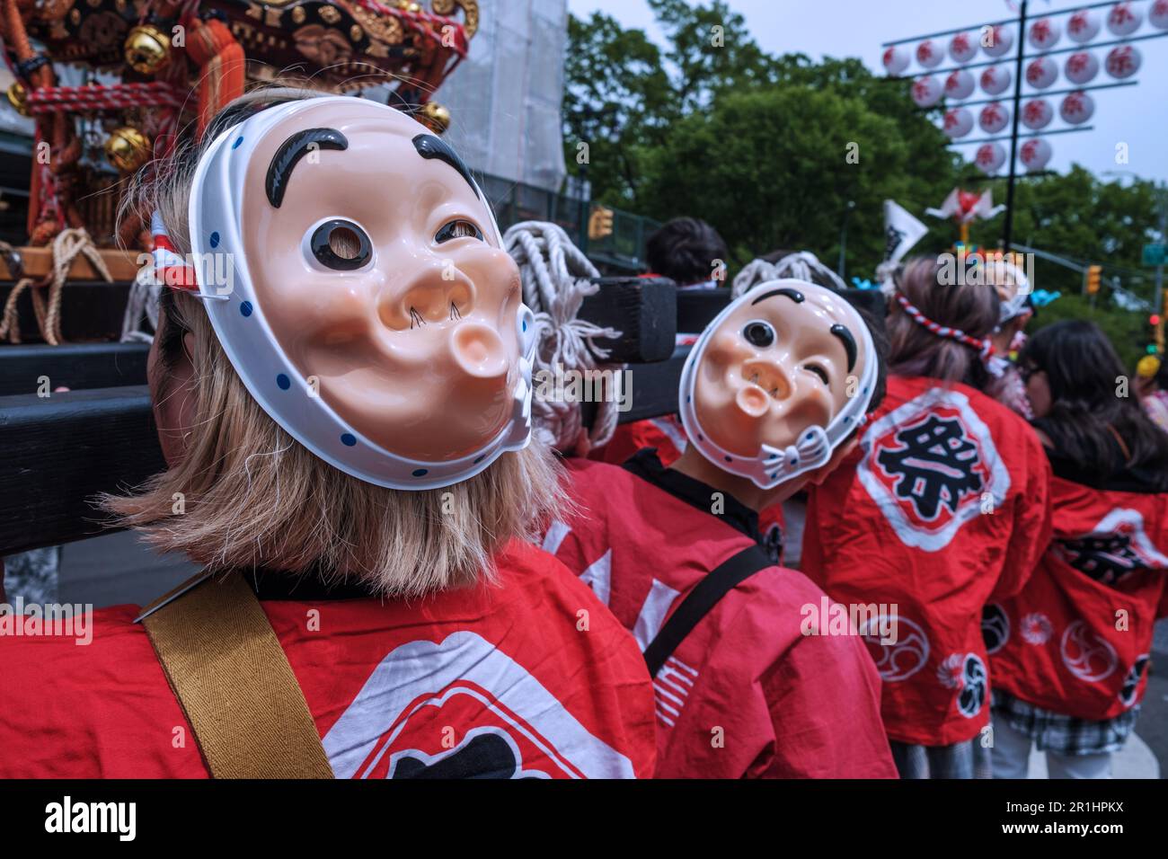 New York, New York, USA. 13th May, 2023. Masked marchers at the Japan ...