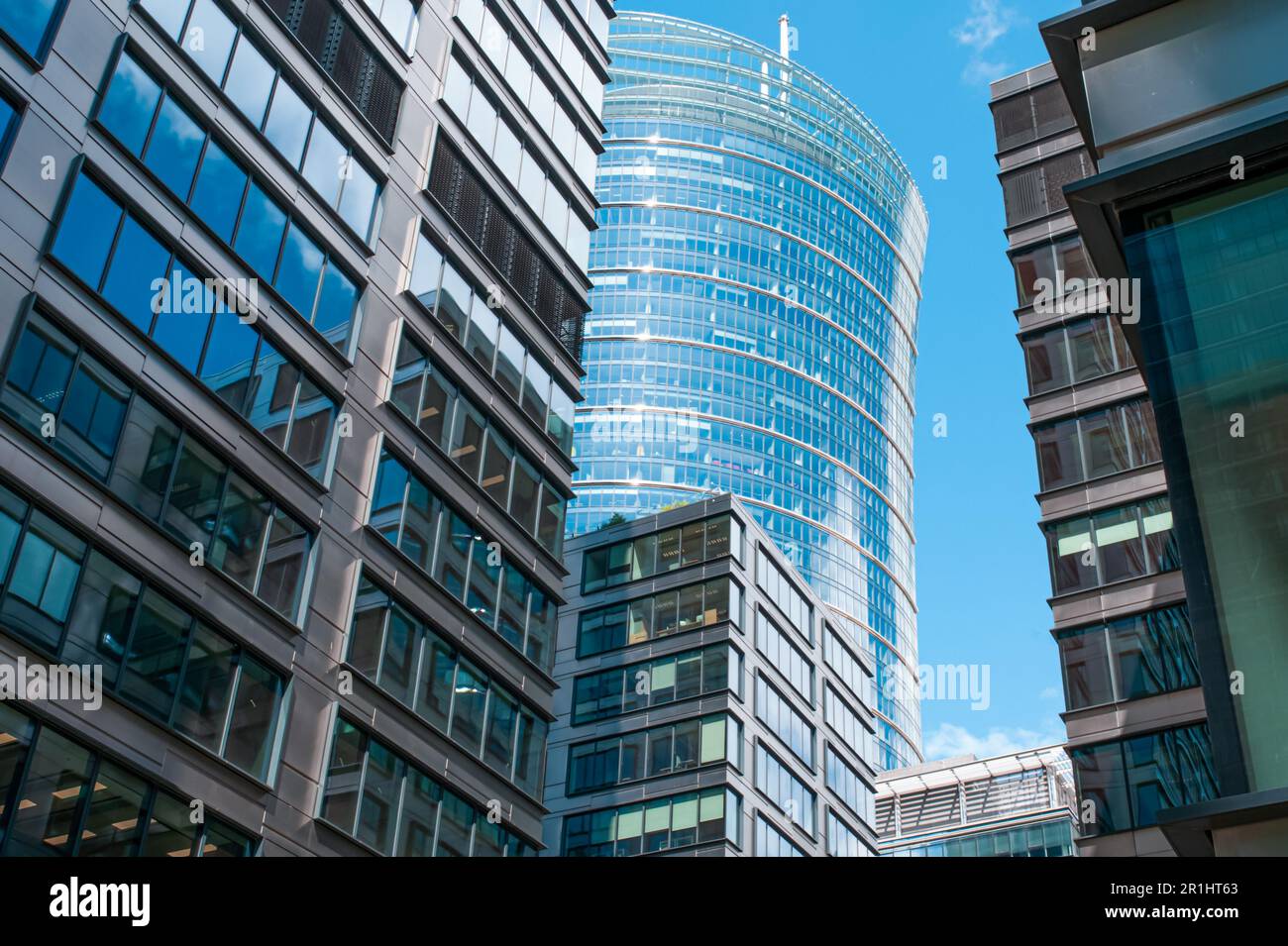 Stylish buildings with many windows under cloudy sky Stock Photo - Alamy