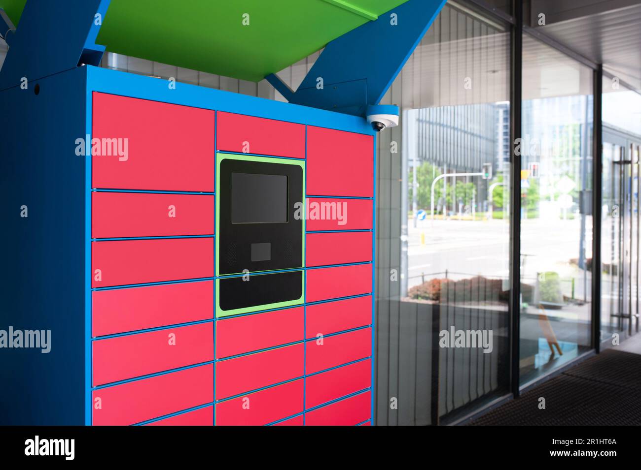 Parcel locker with many postal boxes near building outdoors Stock Photo ...