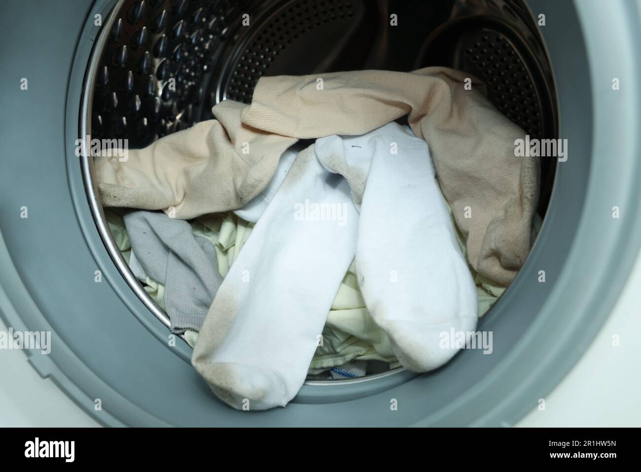 Many dirty socks in washing machine, closeup Stock Photo - Alamy