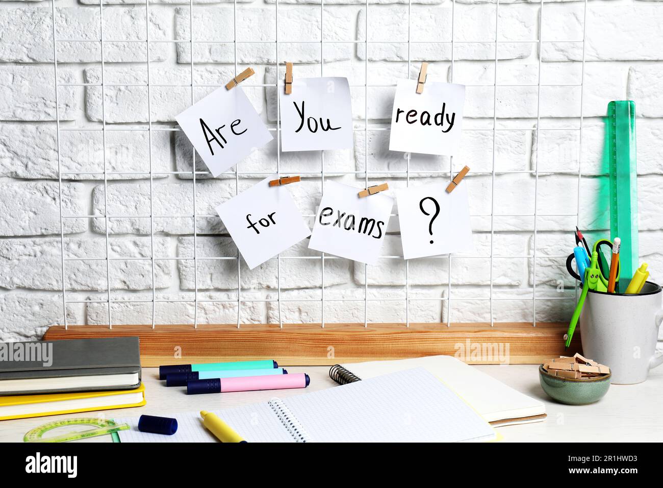 Notes with words Are you ready for exams hanging on white brick wall ...