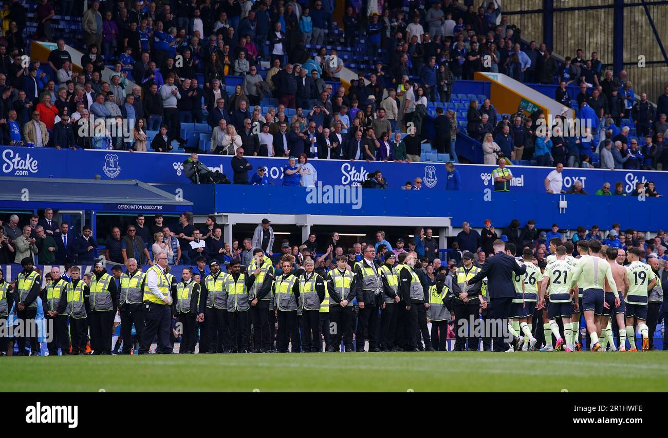 Stewards on the pitch as the Manchester City players walk off after the ...