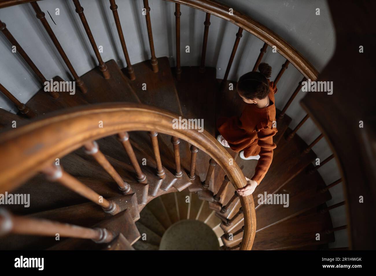 High angle view of little girl going up the wooden stairs Stock Photo ...