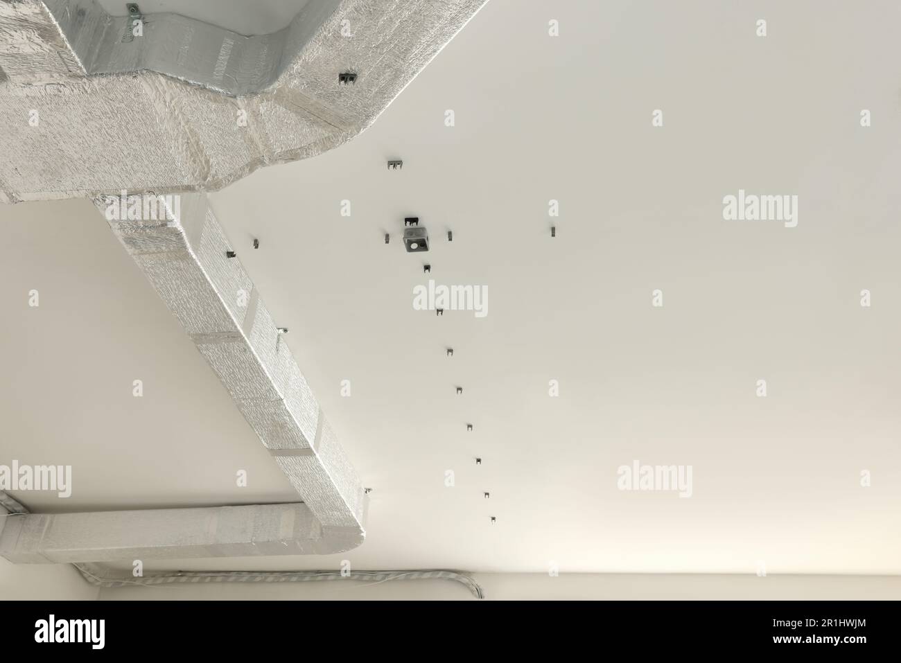 Connectors for wires and ventilation system on ceiling indoors Stock ...