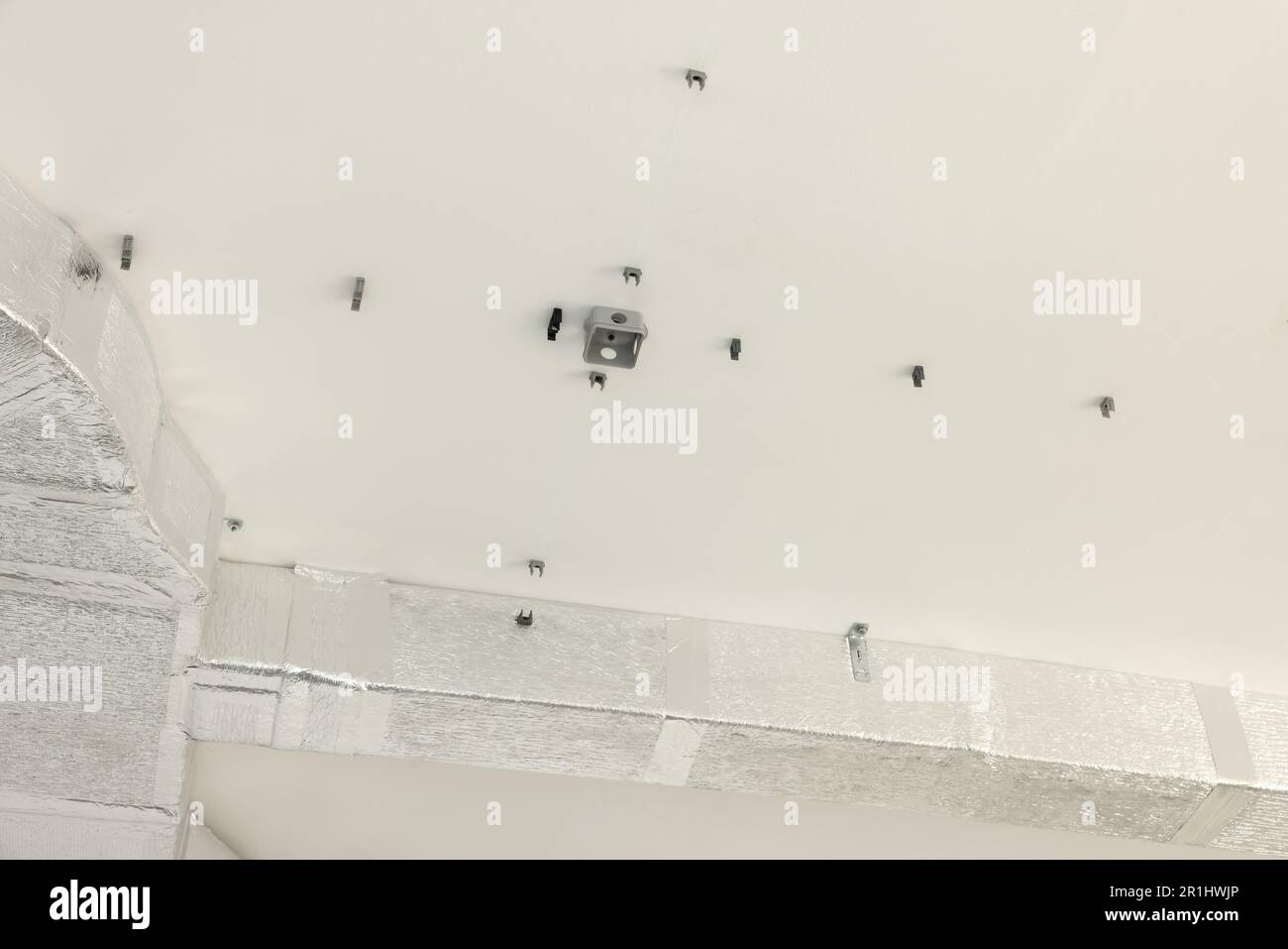 Connectors for wires and ventilation system on ceiling indoors Stock ...