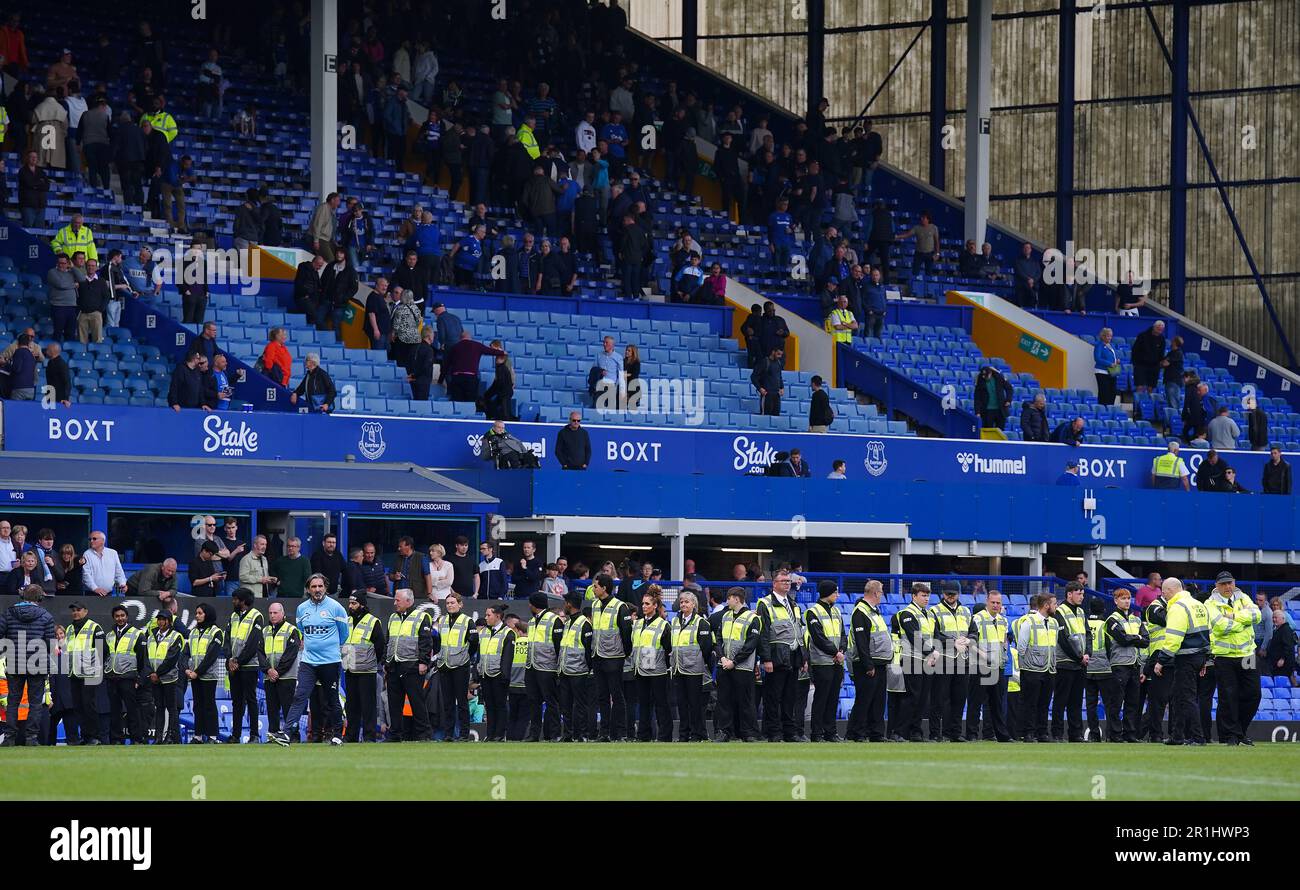 Stewards on the pitch after the final whistle of the Premier League ...