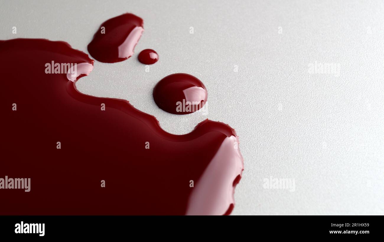 Stain and drops of blood on light grey background, closeup. Space for ...