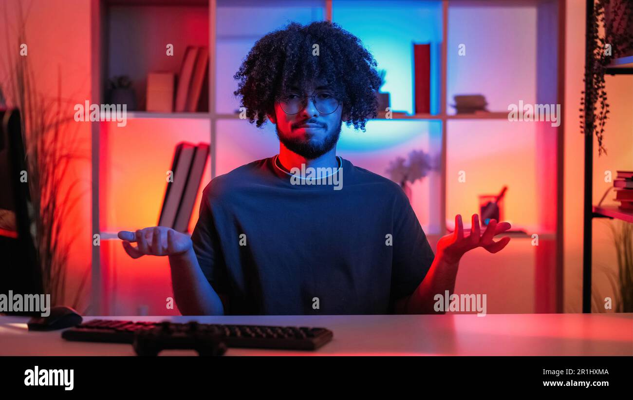 Shrugging gesture confused man silly expression Stock Photo - Alamy