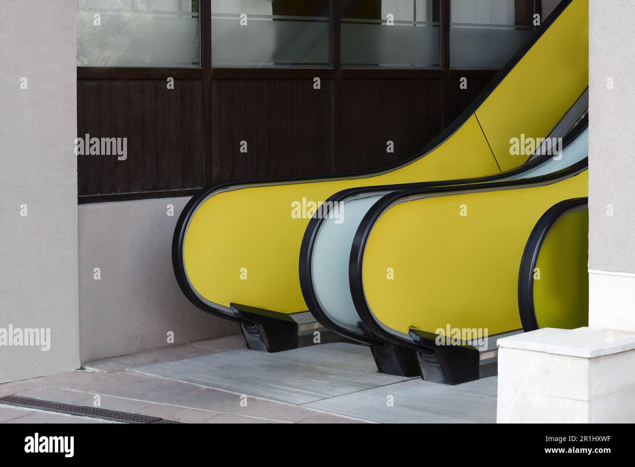 View on empty parallel escalators with yellow balustrades, space for ...