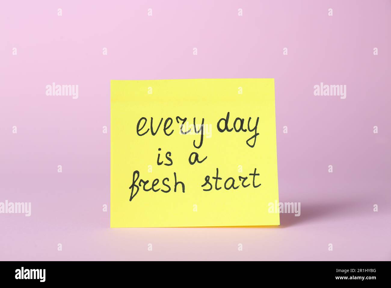 Note with phrase Every Day Is A Fresh Start on pink background ...