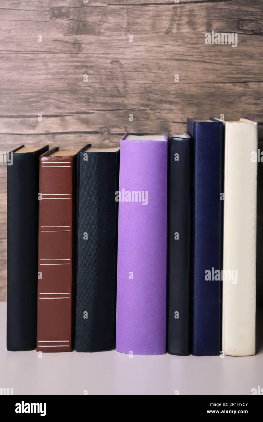 Collection of different books on white shelf Stock Photo - Alamy