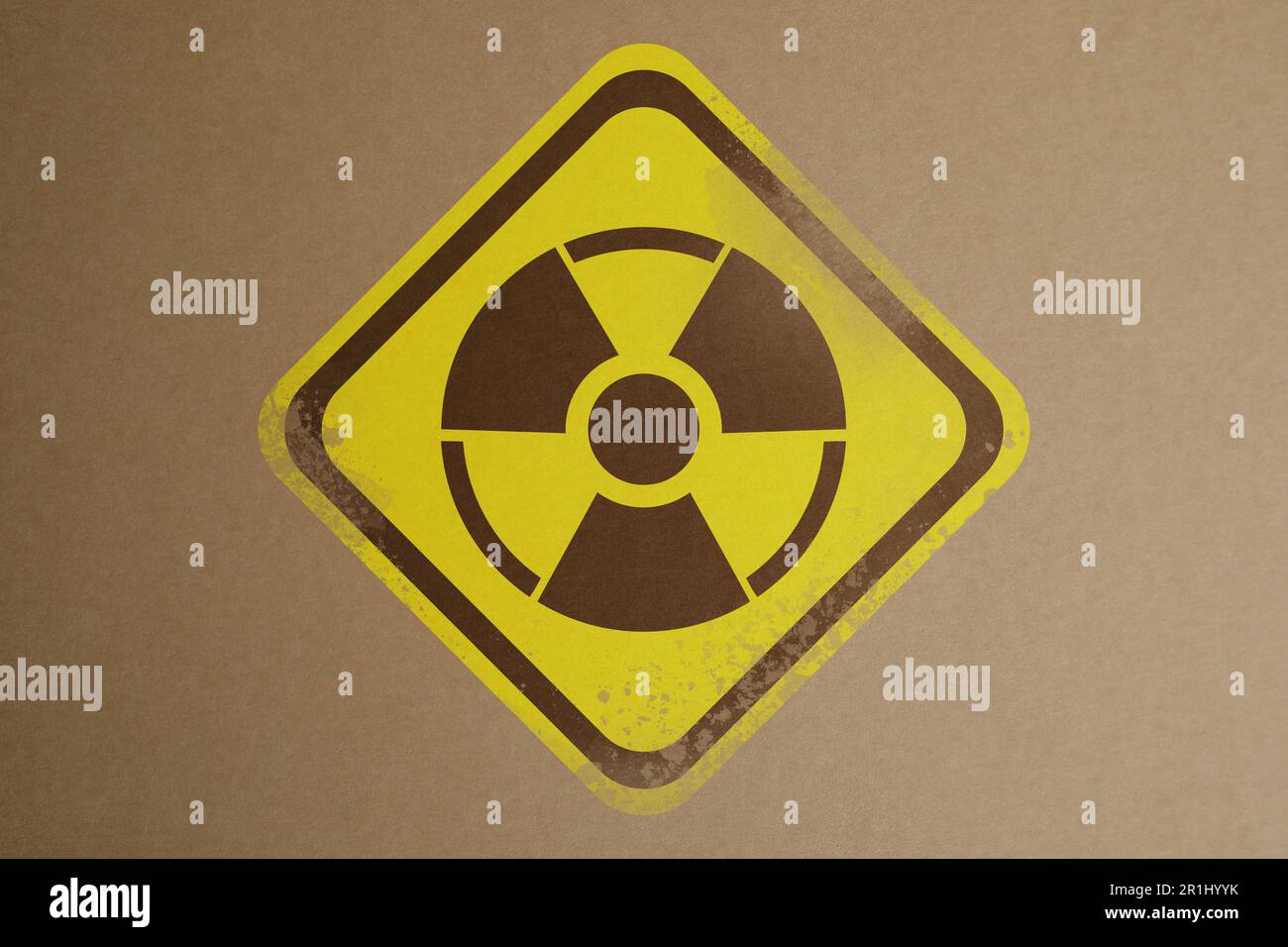 Radioactive sign on brown background. Hazard symbol Stock Photo - Alamy