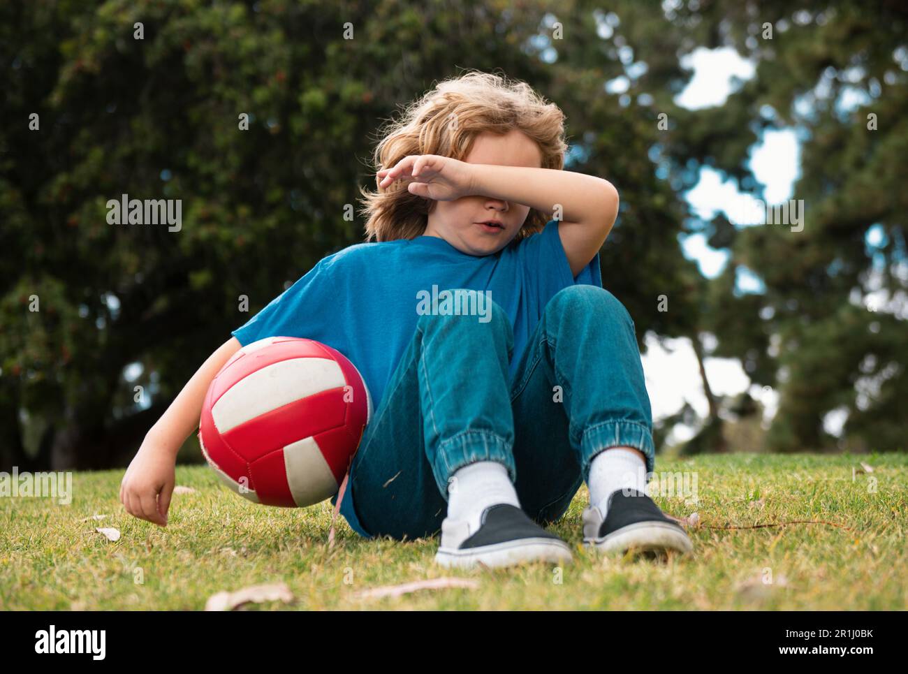 Little boy alone, lonely with ball. Loneliness kids. Children bad ...