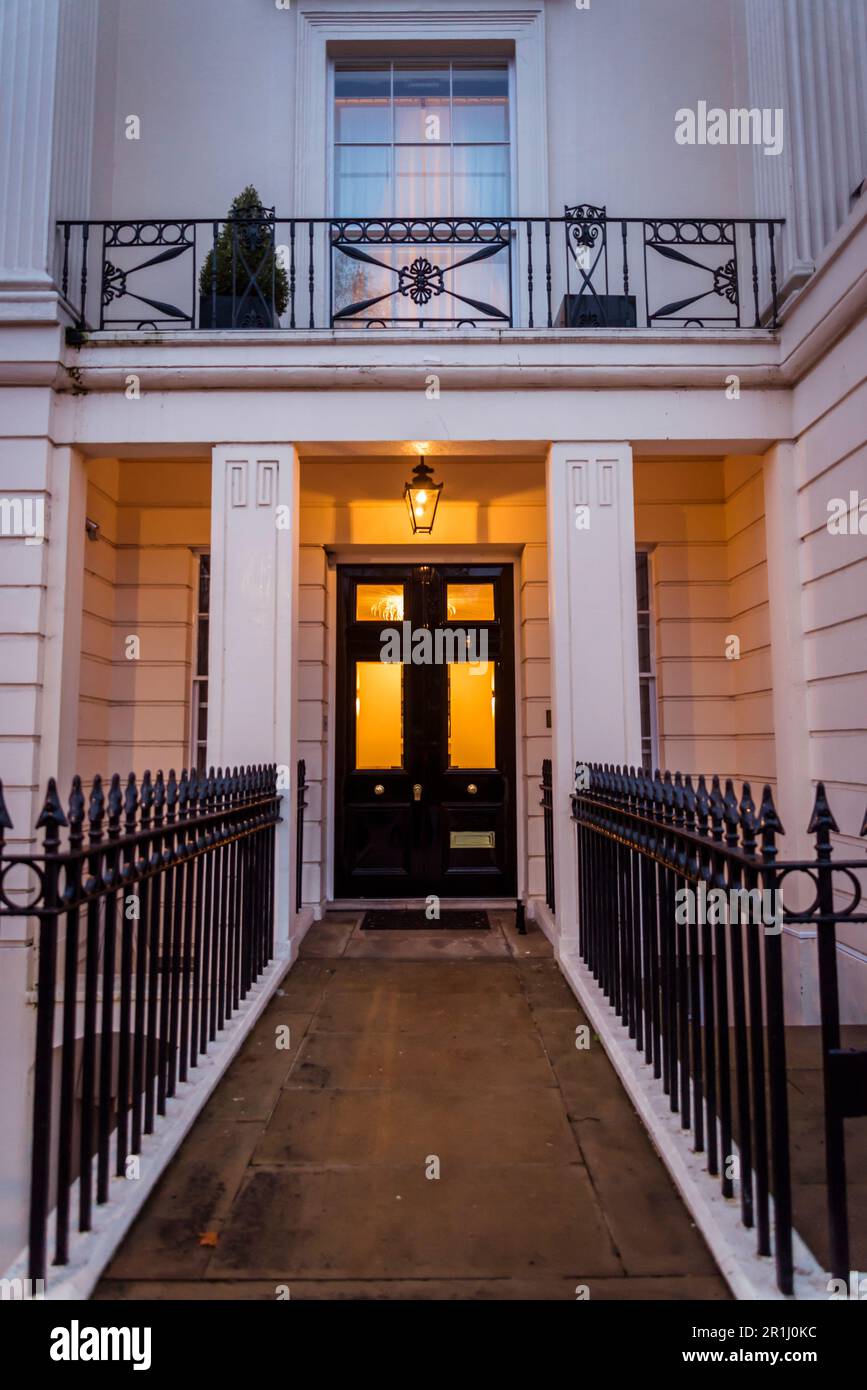 Facade of a posh Regency house near Regent's Park at dusk, London ...