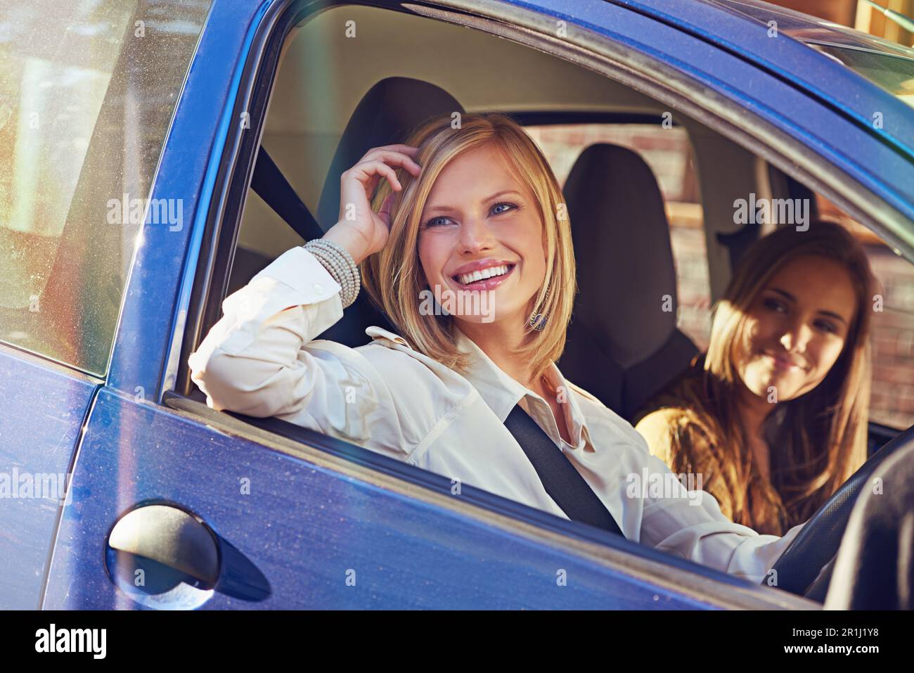 Car, travel and friends smile, happy and on urban city journey ...