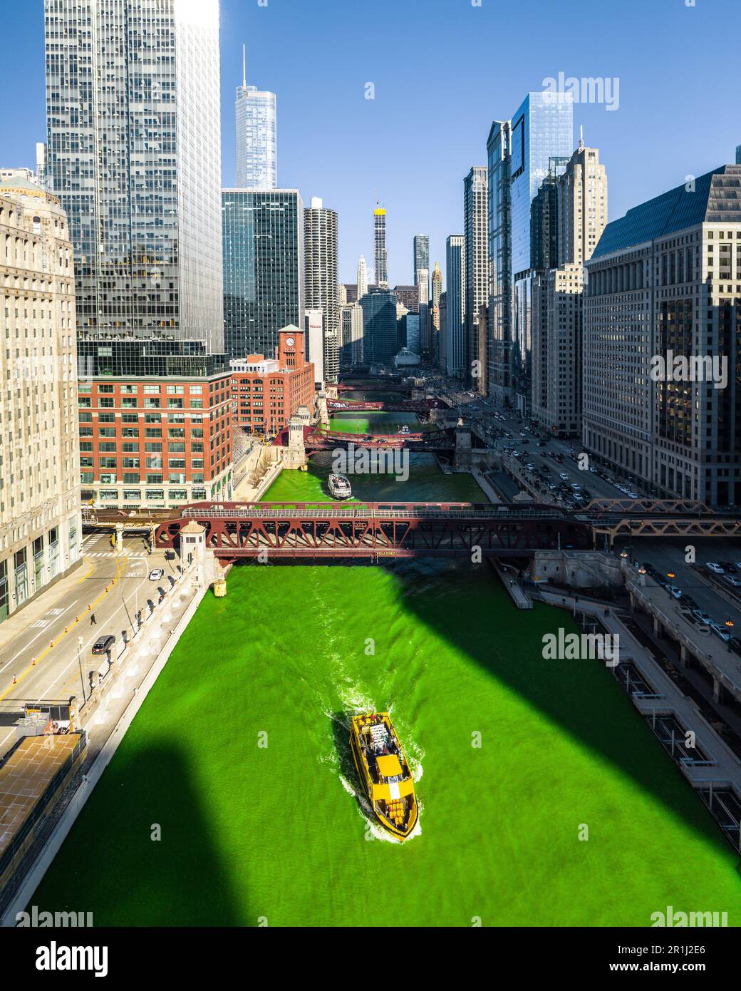 The Beautiful Aerial View of Green Chicago River on with a Yellow Boat ...