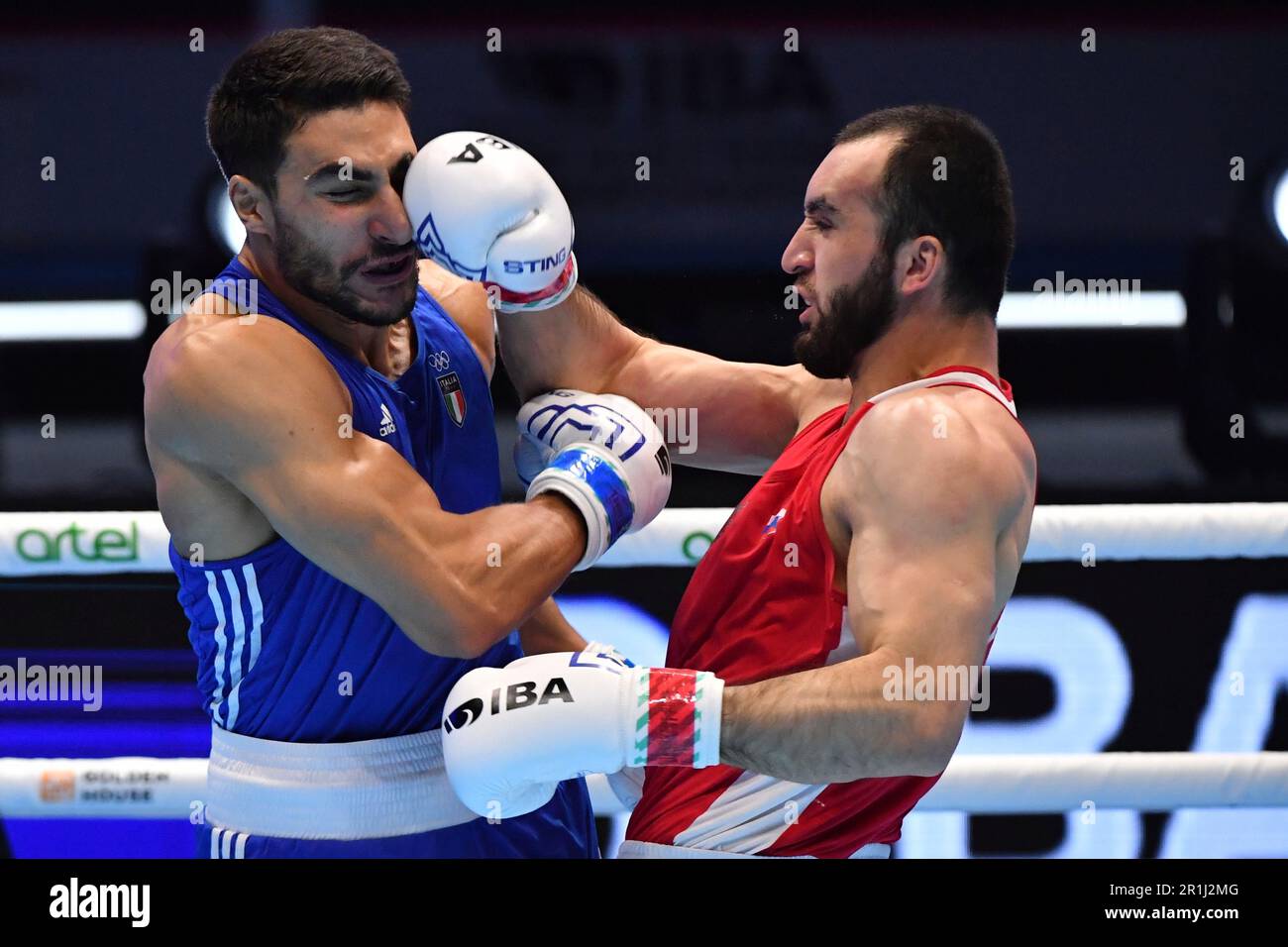 Russia's Muslim Gadzhimagomedov, red, fights with Italia's Aziz Abbes ...