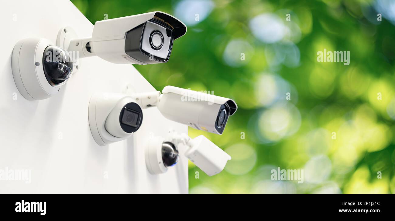Surveillance cameras on a green background. Perimeter security. High ...