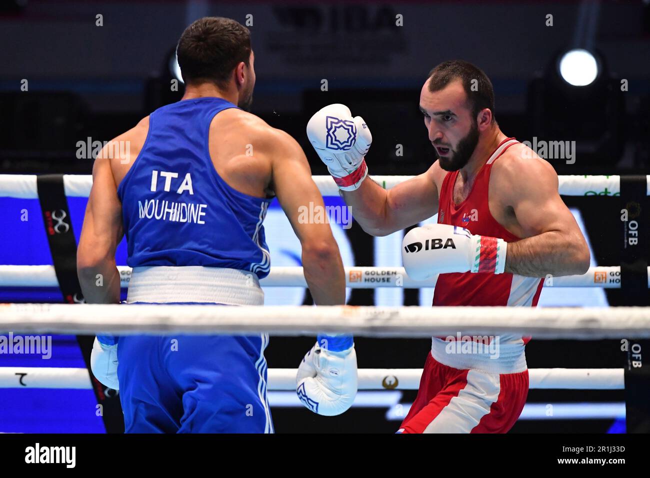 Russia's Muslim Gadzhimagomedov, red, fights with Italia's Aziz Abbes ...